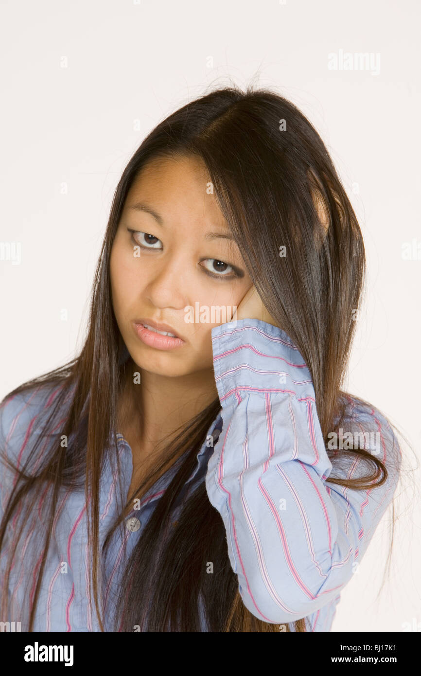 Asian woman showing signs of stress Stock Photo - Alamy
