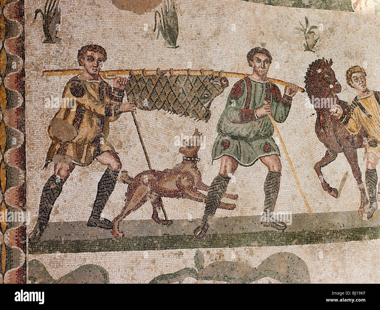 After the Hunt: bearing the boar home. Two men carry a stick with a ...