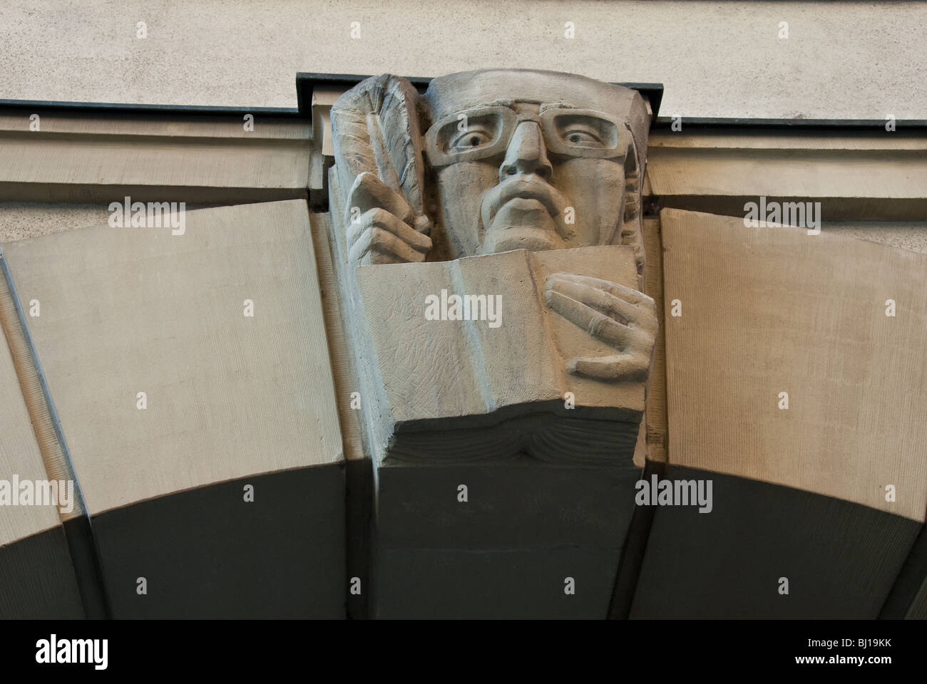 Keystone or stone building sculpture on the City Hall and Grafeneckart ...