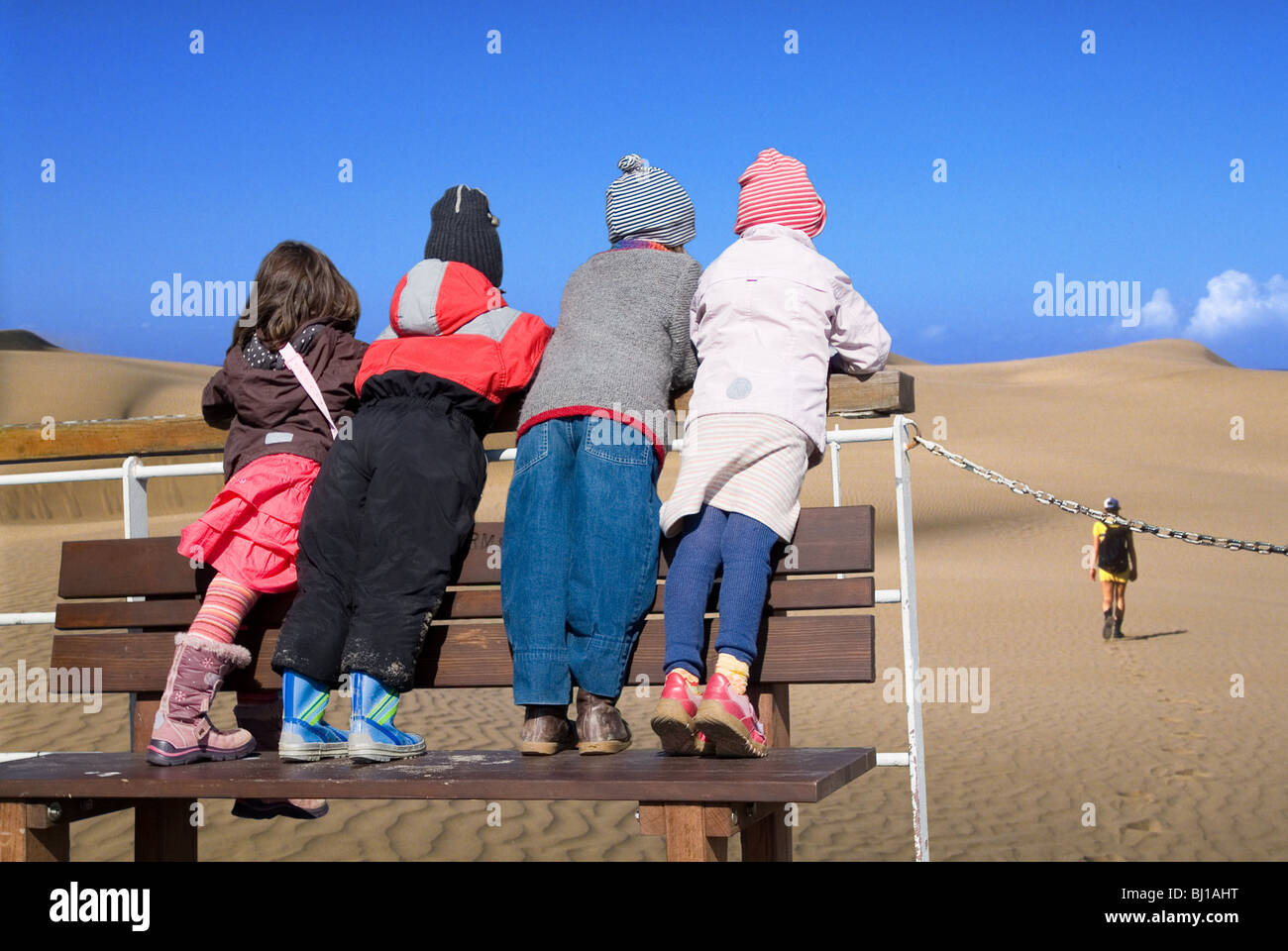 Children standing on a bench and looking at the desert Stock Photo - Alamy