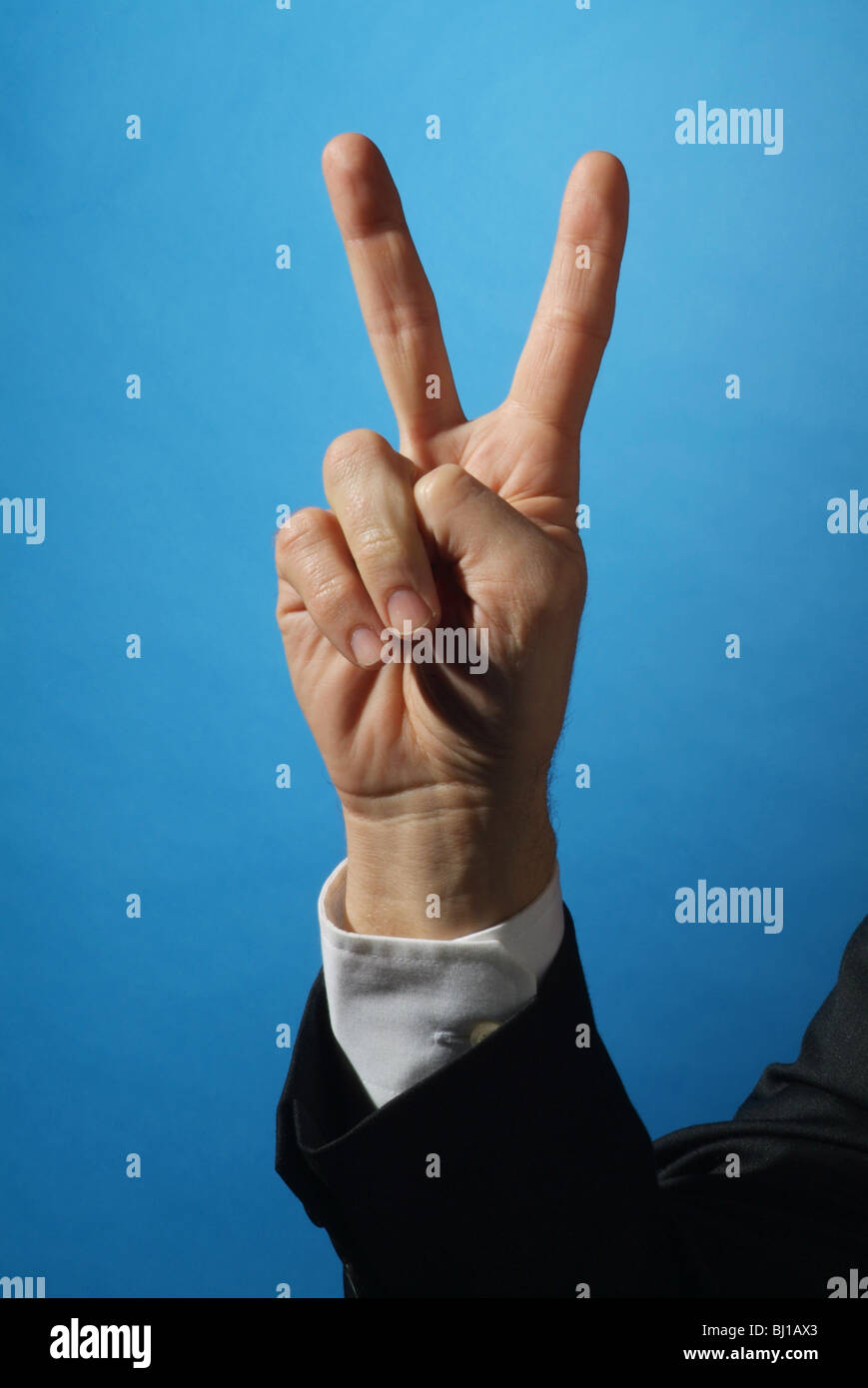 Hand showing victory sign Stock Photo - Alamy