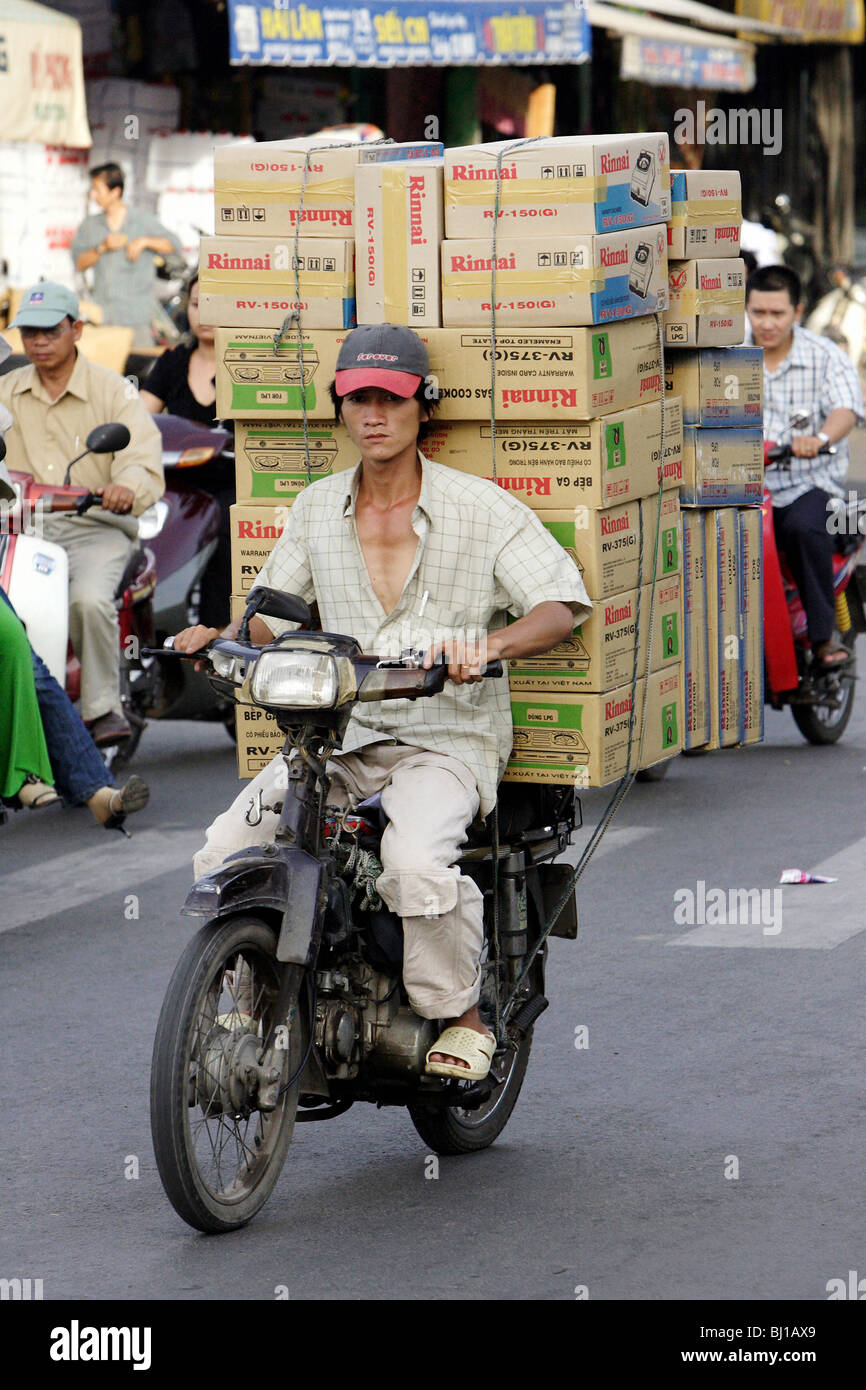 Overloaded deliverer's moped, Ho Chi Minh City, Vietnam Stock Photo - Alamy