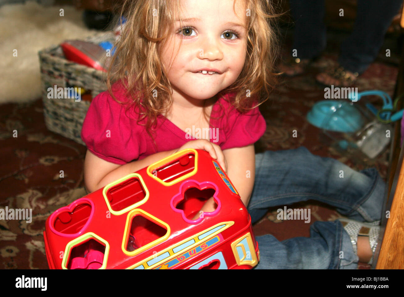 girl playing with shape sorter Stock Photo - Alamy