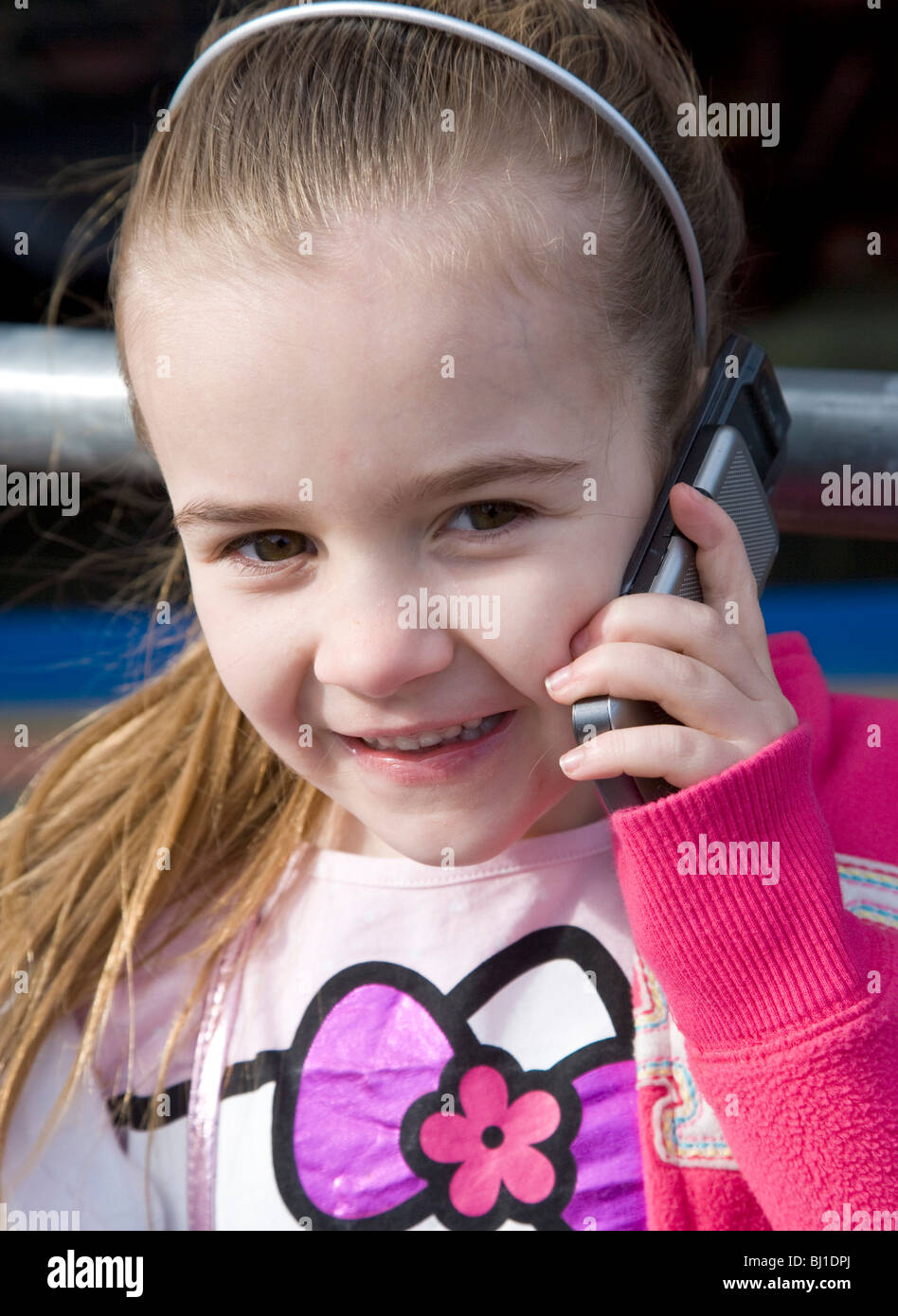 Child Using a Mobile Cell Phone Stock Photo - Alamy