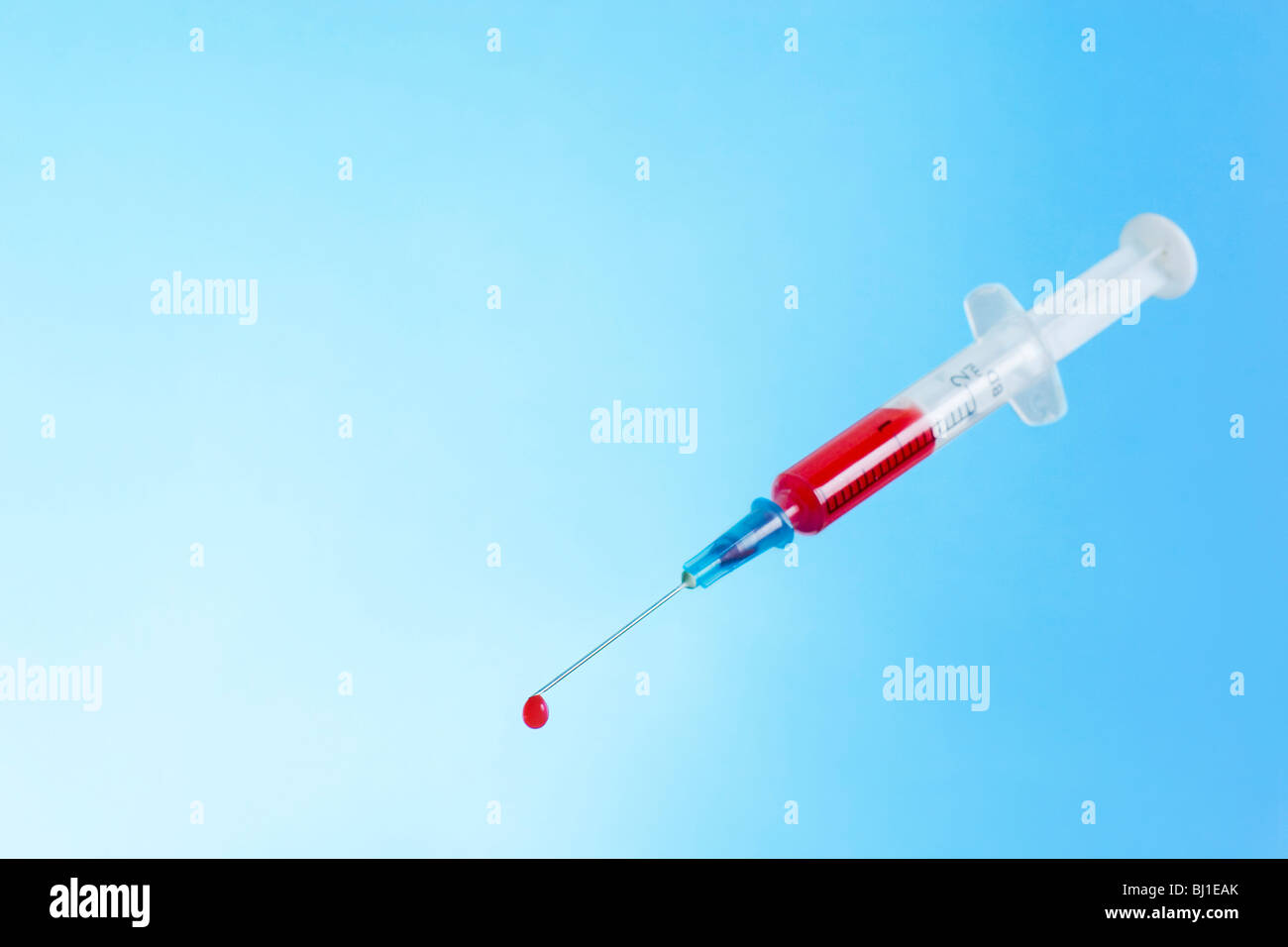syringe with fresh blood. One drop on needle-point Stock Photo - Alamy