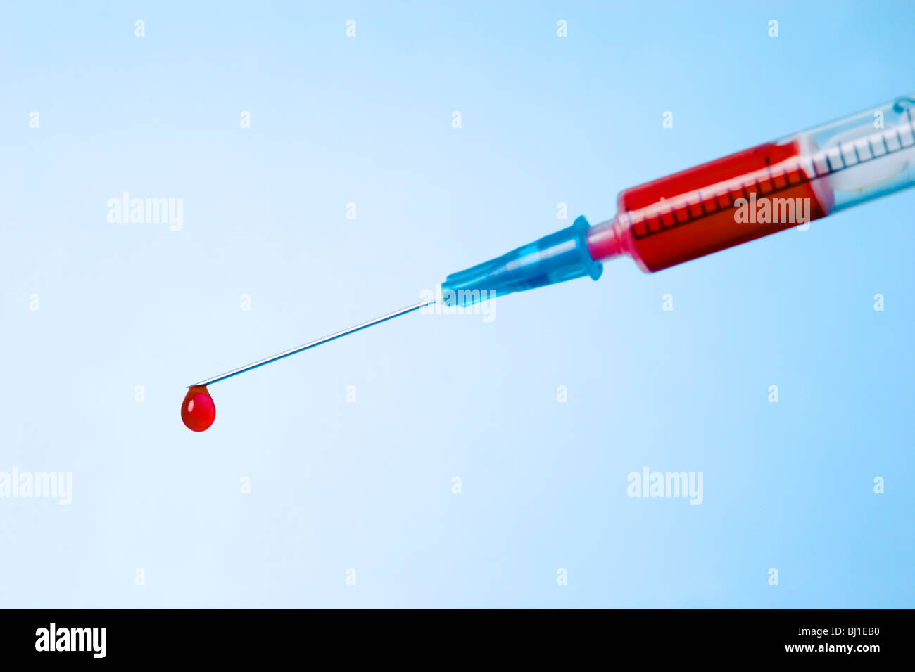 syringe with fresh blood. One drop on needle-point Stock Photo - Alamy