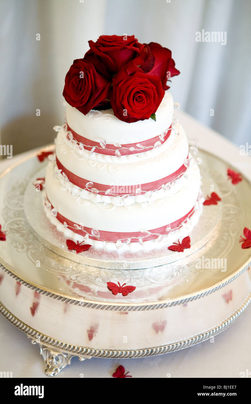 White Wedding Cake With Red Roses