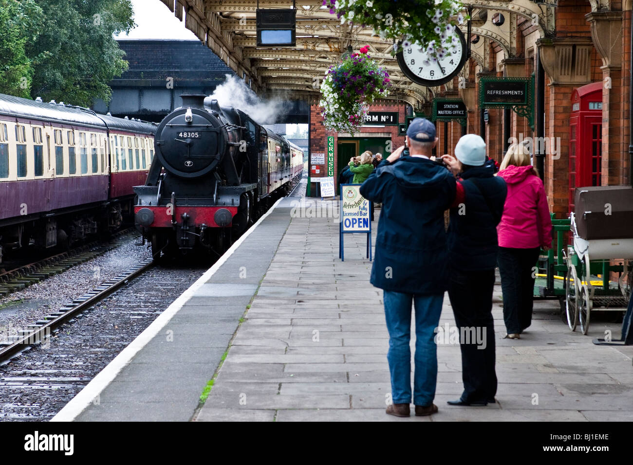 Steam engine 48305 enters Loughborough station as enthusiats look on ...