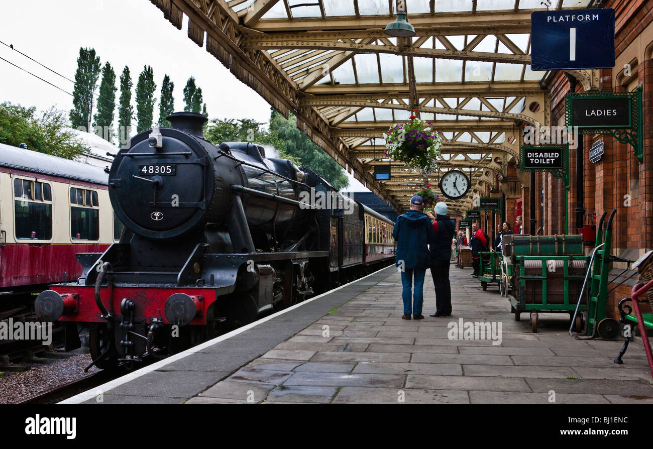 Steam engine 48305 enters Loughborough station as enthusiats look on ...