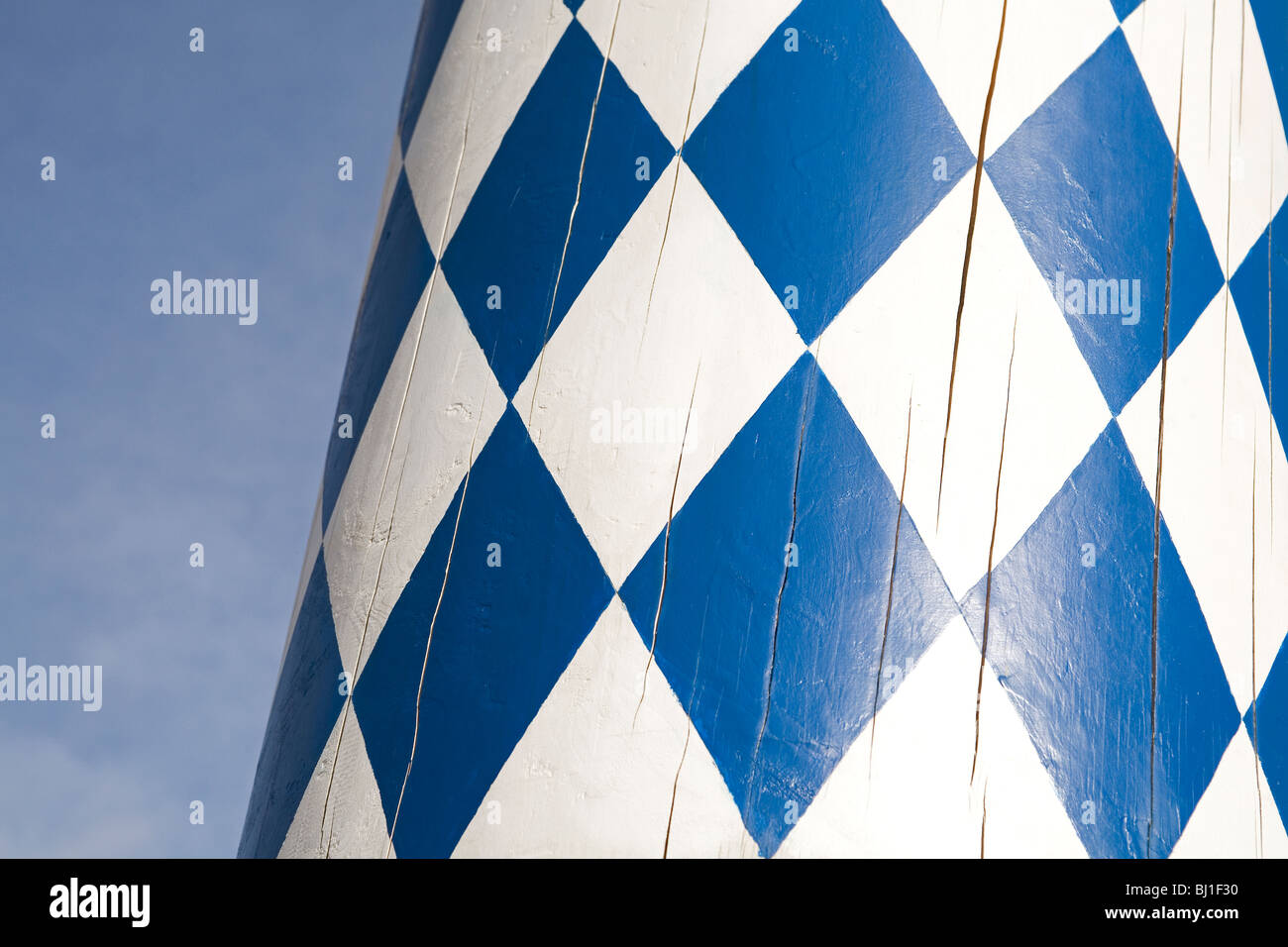 A maypole in Bavaria is decorated with the blue and white diamonds of ...