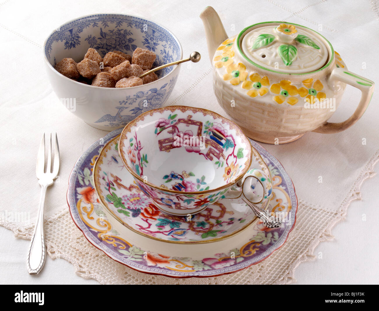 A stack of antique crockery tea pot sugar bowl Stock Photo - Alamy