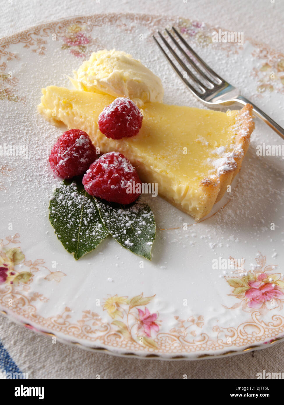 Individual lemon tart slice Stock Photo - Alamy