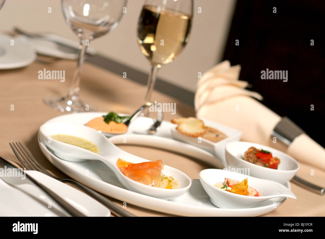 Starter or Entree of a french dish with fish, seafood mixed and foie ...