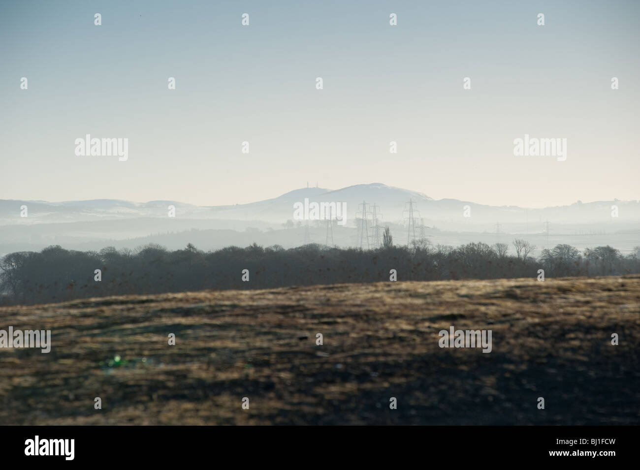 Electricity pylons in the early morning light Stock Photo - Alamy