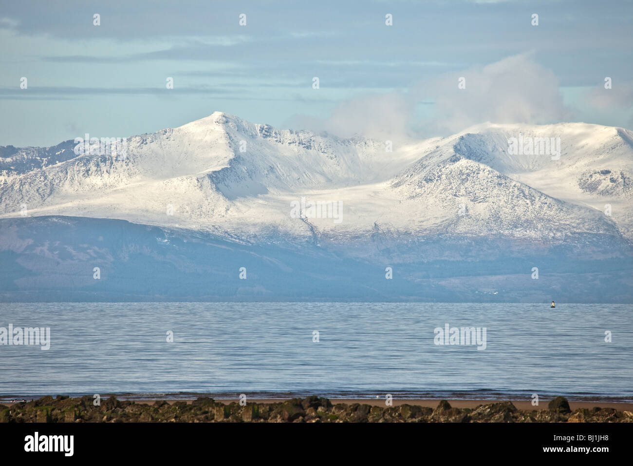 Goat Fell and the Isle of Arran in the Firth of Clyde covered in snow ...
