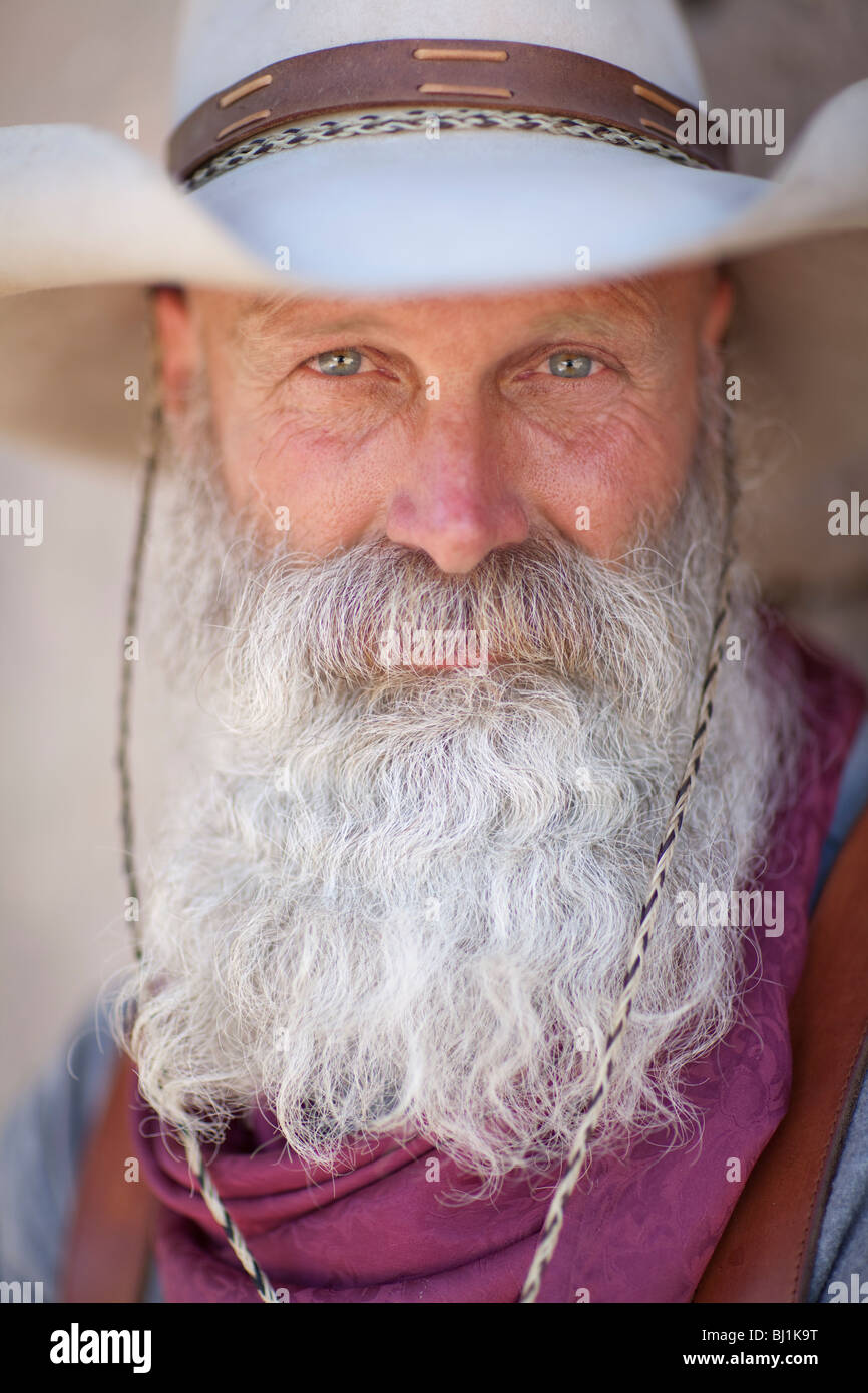 A cowboy with a white beard looking at camera Stock Photo - Alamy