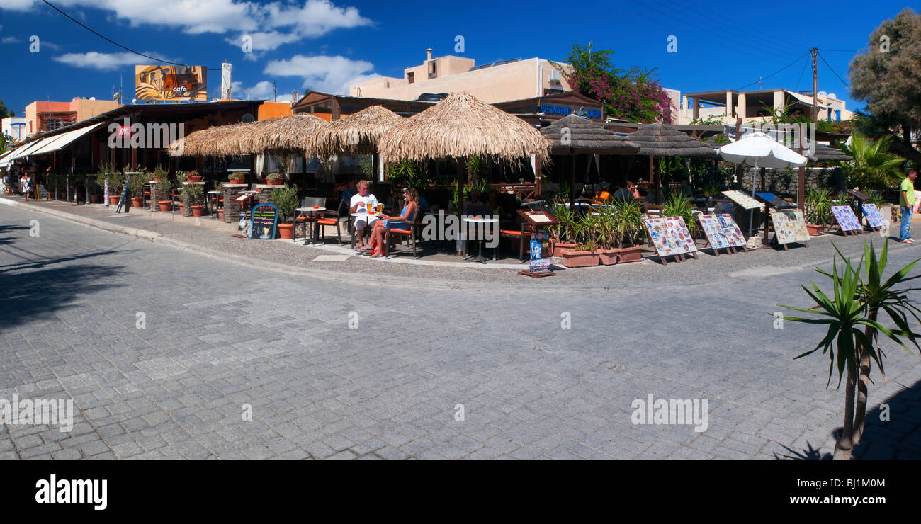 The beach promenade with it's shops and restaurants in Kamari ...