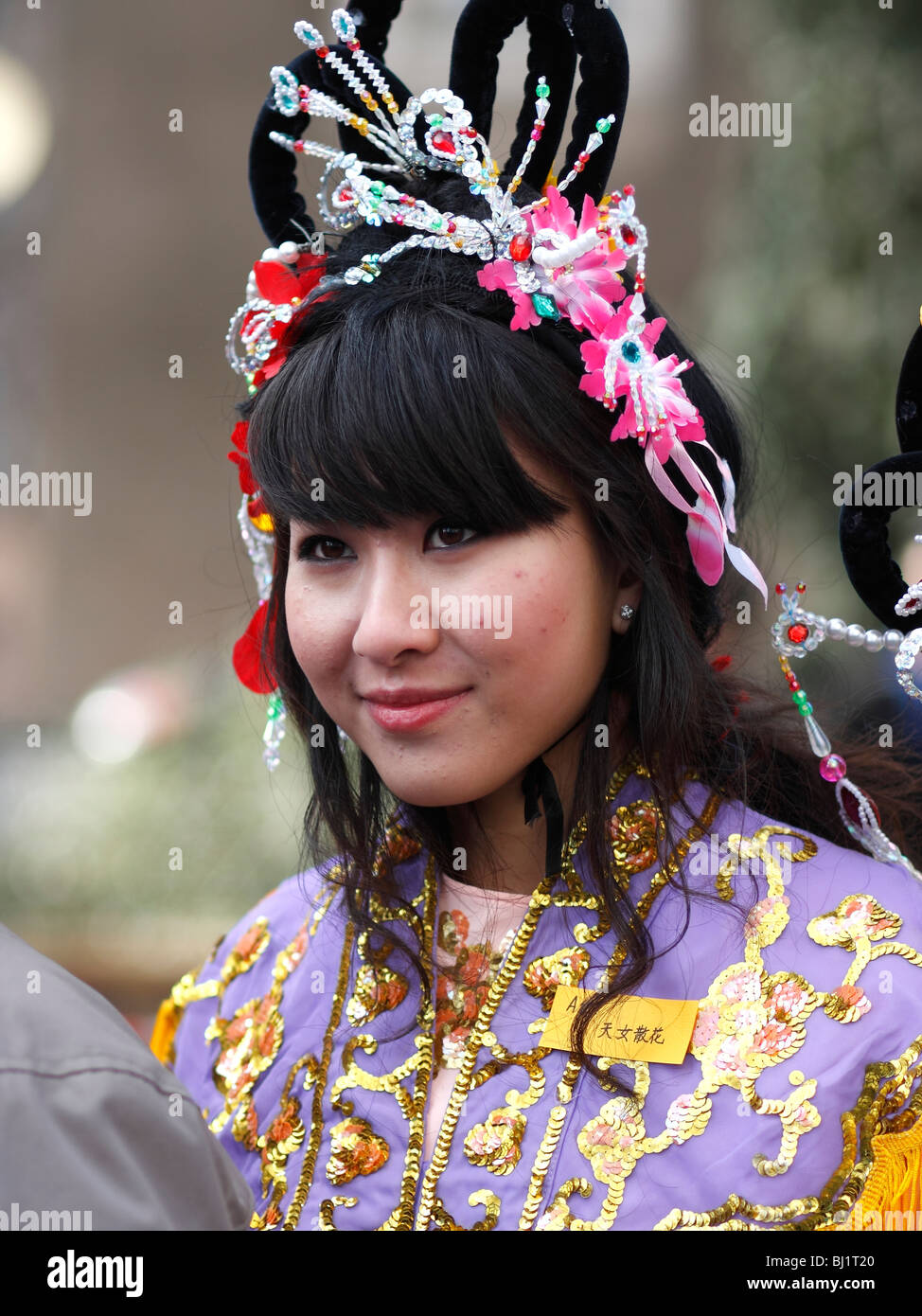 A female performer at the Chinese New Year parade in the streets of ...