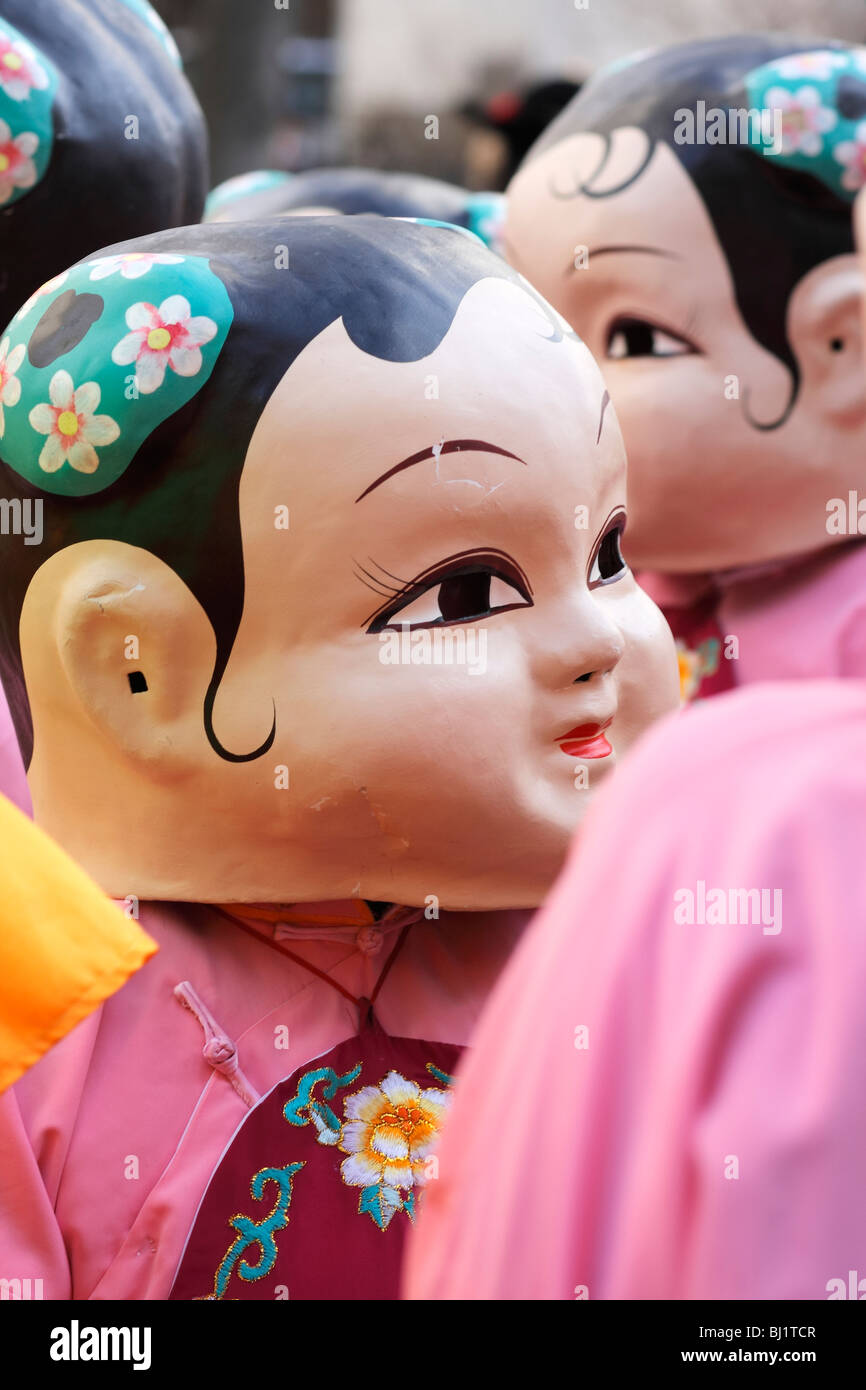 Performers with traditional masks at the Chinese New Year parade in the ...