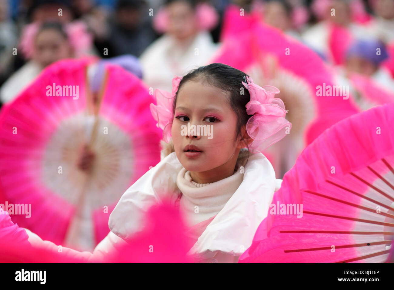 A young girl performing the fan dance at the Chinese New Year parade in ...