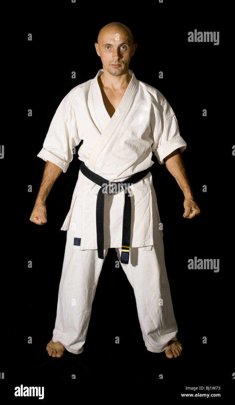 The serious karateka men is fighting Stock Photo - Alamy