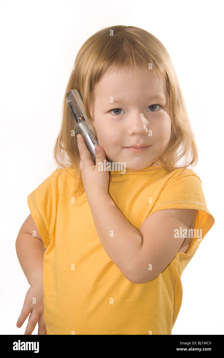 Small pretty girl is calling by phone Stock Photo - Alamy