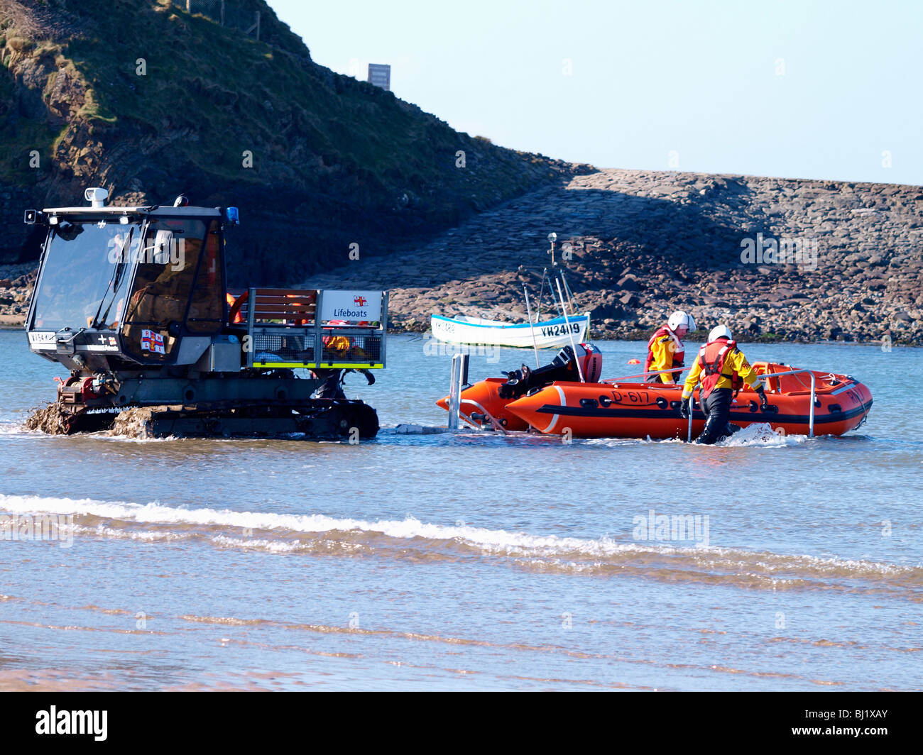 Sea tractor putting inshore lifeboat into the sea, Bude, Cornwall Stock ...