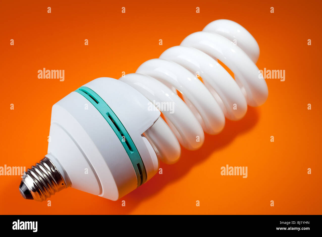 photo shot of fluorescent light bulb on color background Stock Photo ...