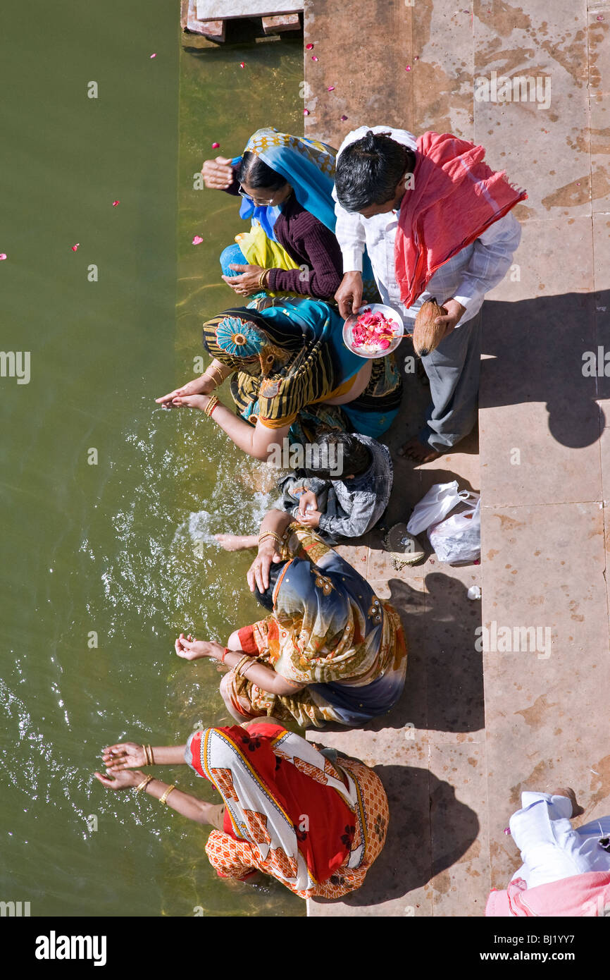 Women making a puja (ritual offering). Brahma Ghat. Pushkar Lake ...