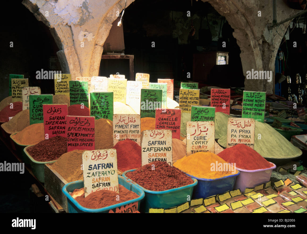 bowls filled with safran spices for sale in a Tunisian market with ...