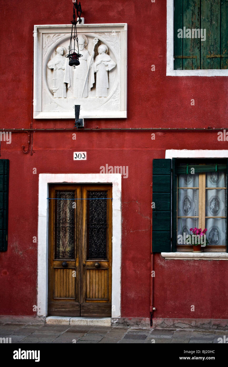 Red fronted building in a square in Venice, Veneto, Italy Stock Photo ...