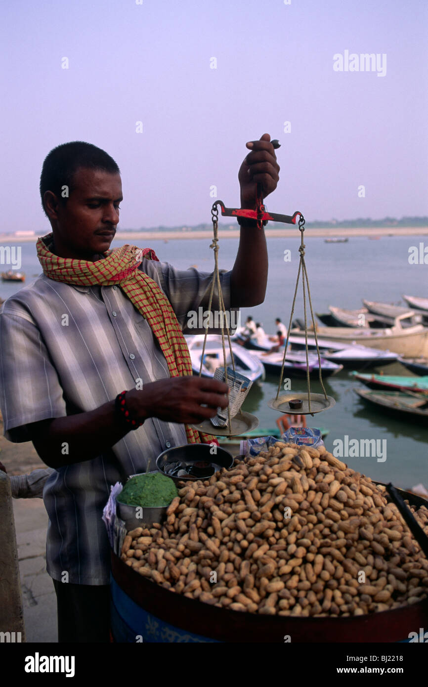 India, Uttar Pradesh, Varanasi, peanuts seller along the Ganges river ...