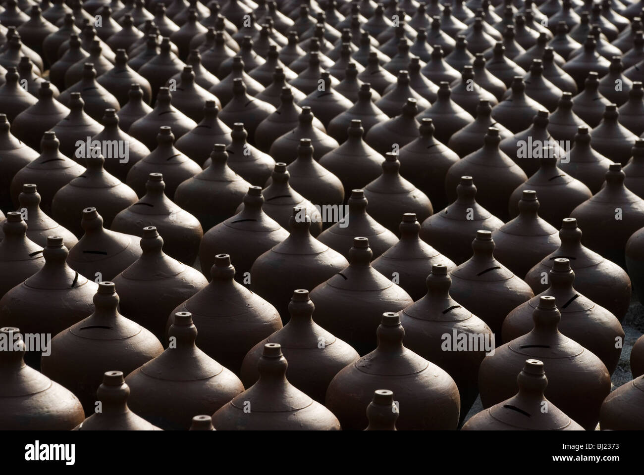 Pottery products being dried under morning sun Stock Photo - Alamy