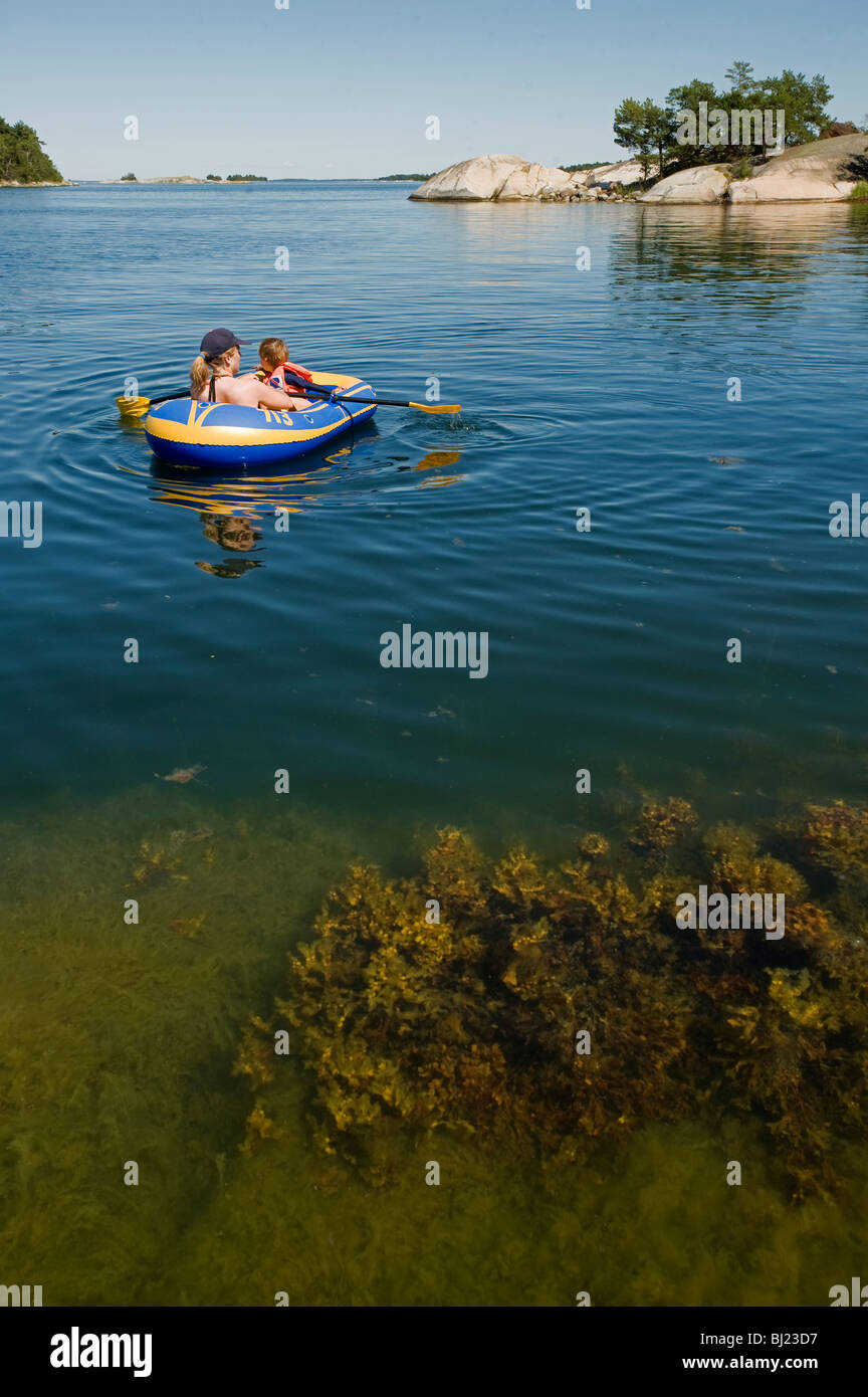 Child rowing a boat hi-res stock photography and images - Alamy