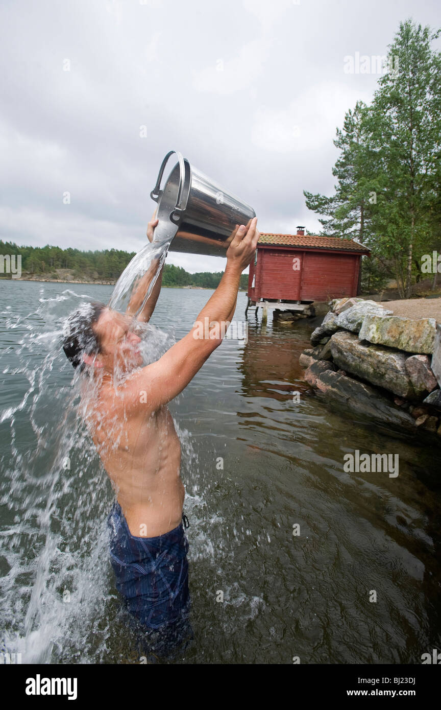 Man pouring bucket water hi-res stock photography and images - Alamy