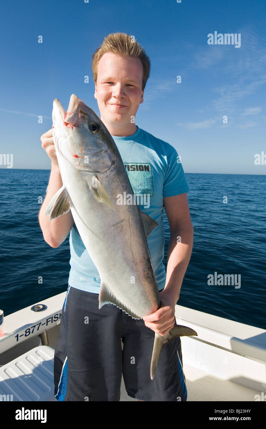 A young man with heÂ´s catch Stock Photo - Alamy