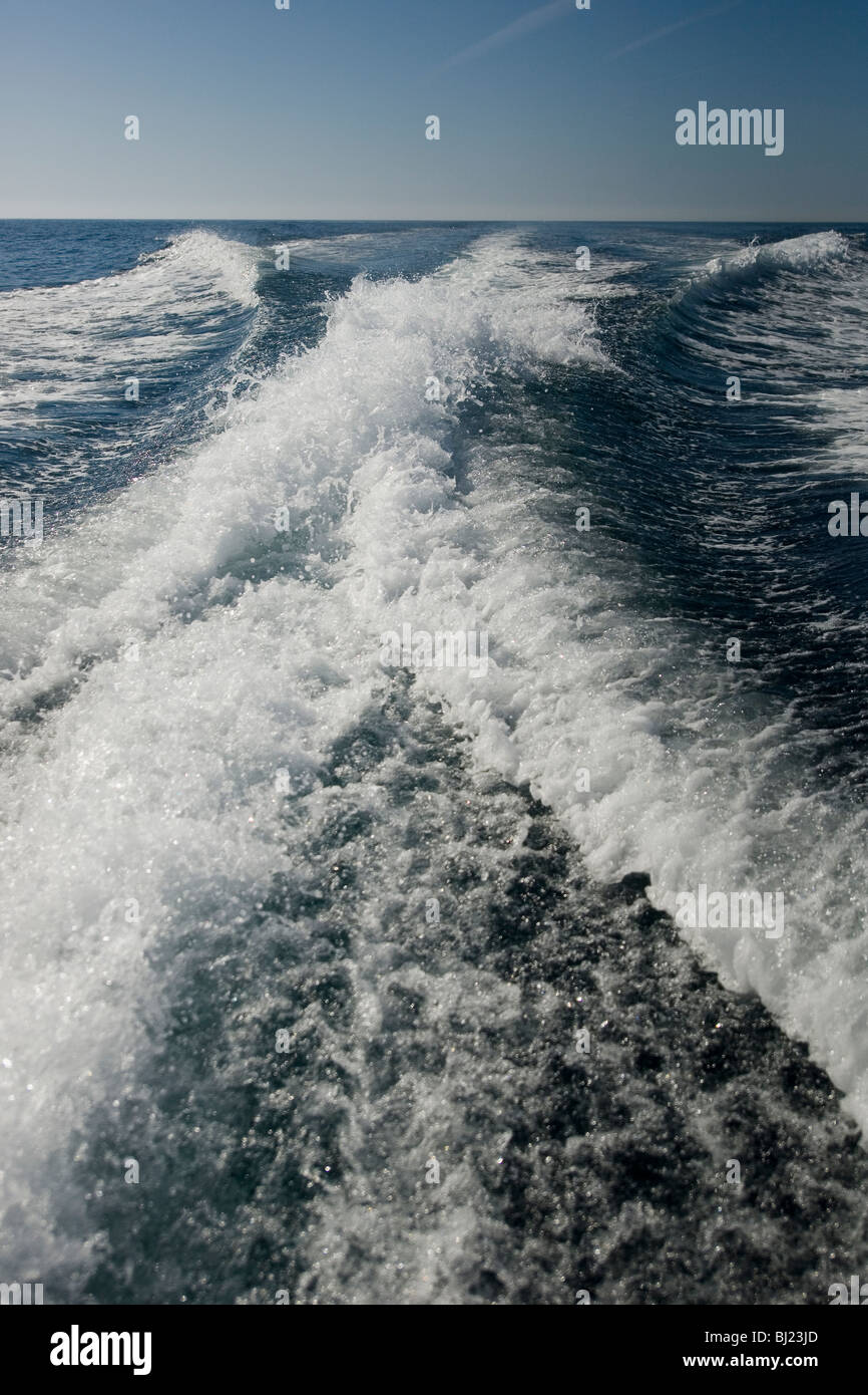 Waves behind a boat Stock Photo - Alamy