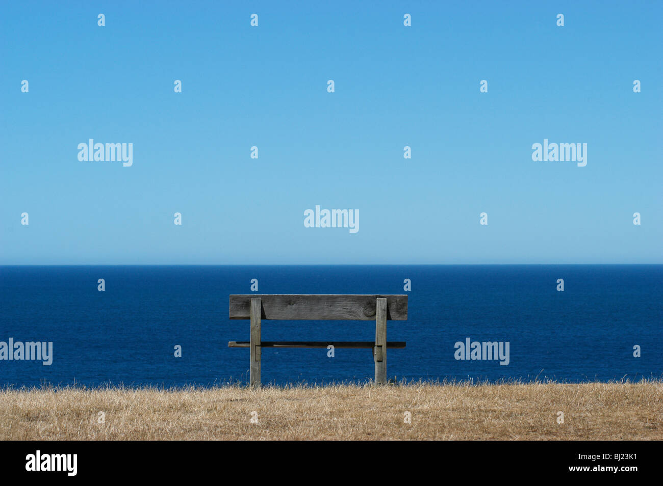 A bench at the ocean Stock Photo - Alamy