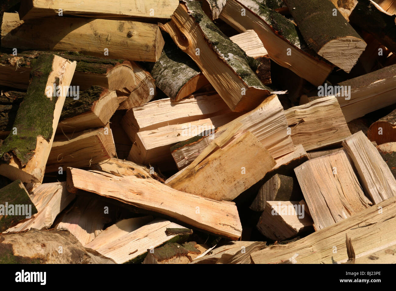 Cut logs chopped for burning Stock Photo - Alamy