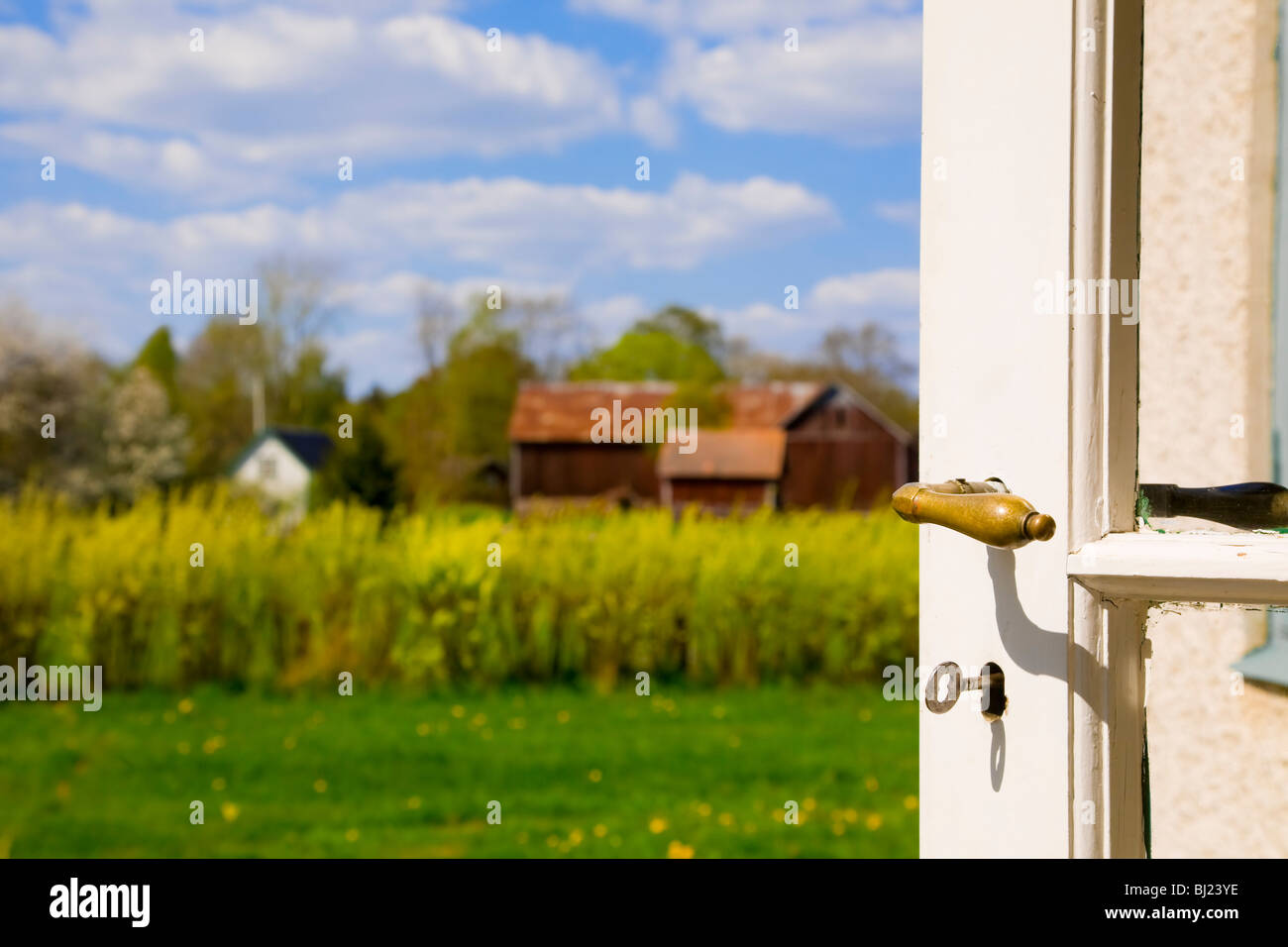 Door opening to a spring landscape Stock Photo - Alamy