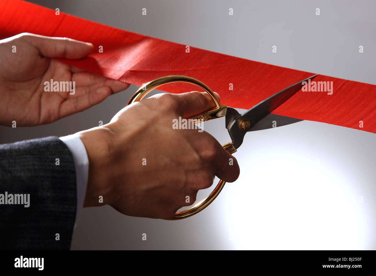 Ribbon cutting,still life Stock Photo - Alamy