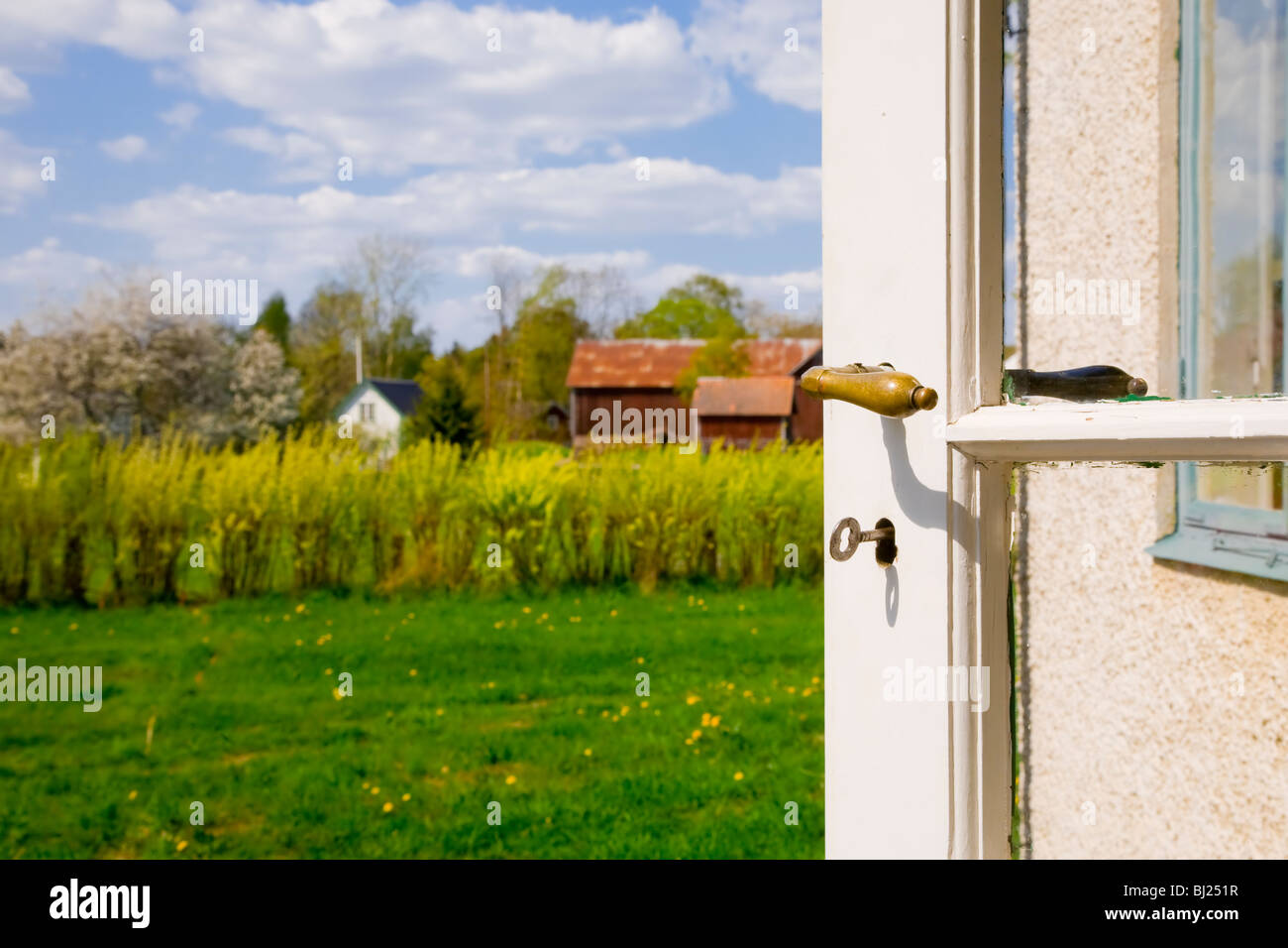 Door opening to a spring landscape Stock Photo - Alamy