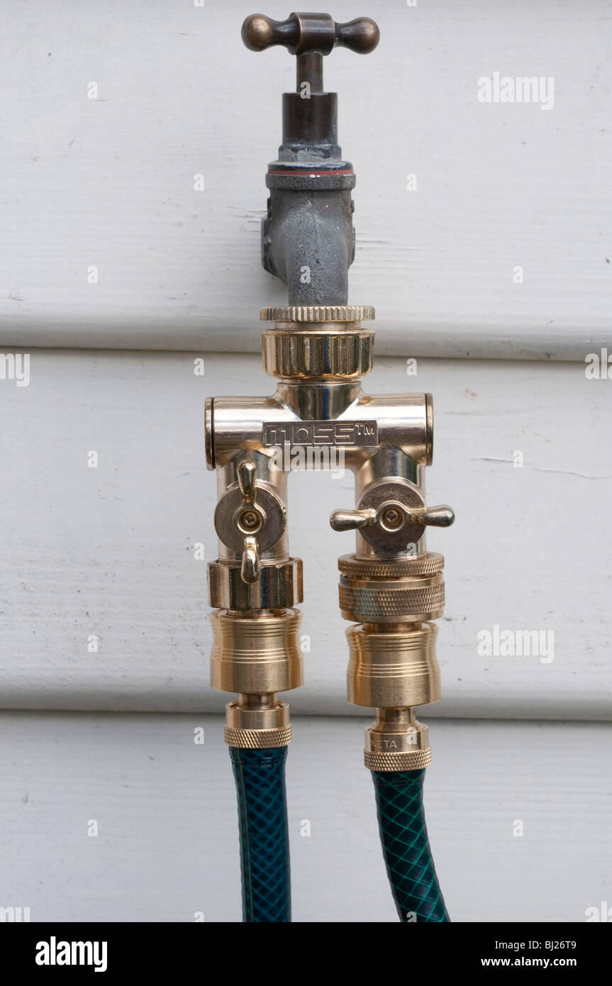 A brass tap with a device to permit the use of two hoses simultaneously ...