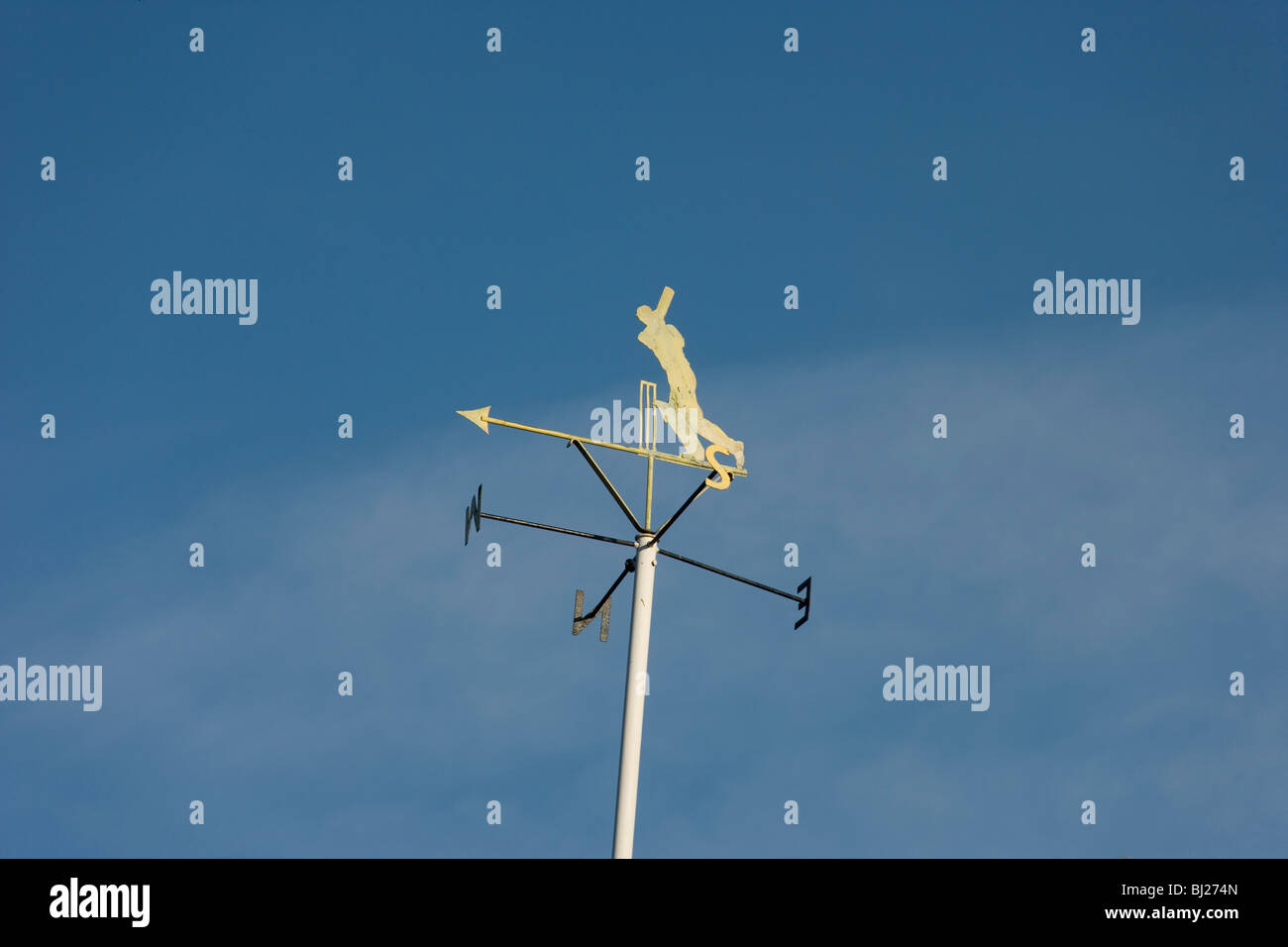 Weather vane in the shape of a cricketer on the cricket pitch at ...
