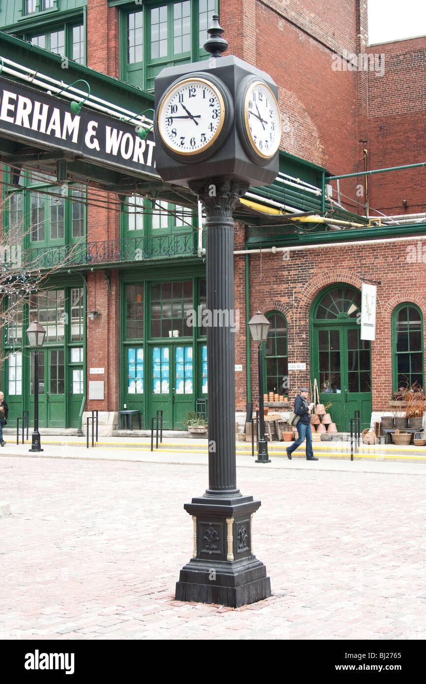 Clock in the middle of the distillery district Stock Photo - Alamy
