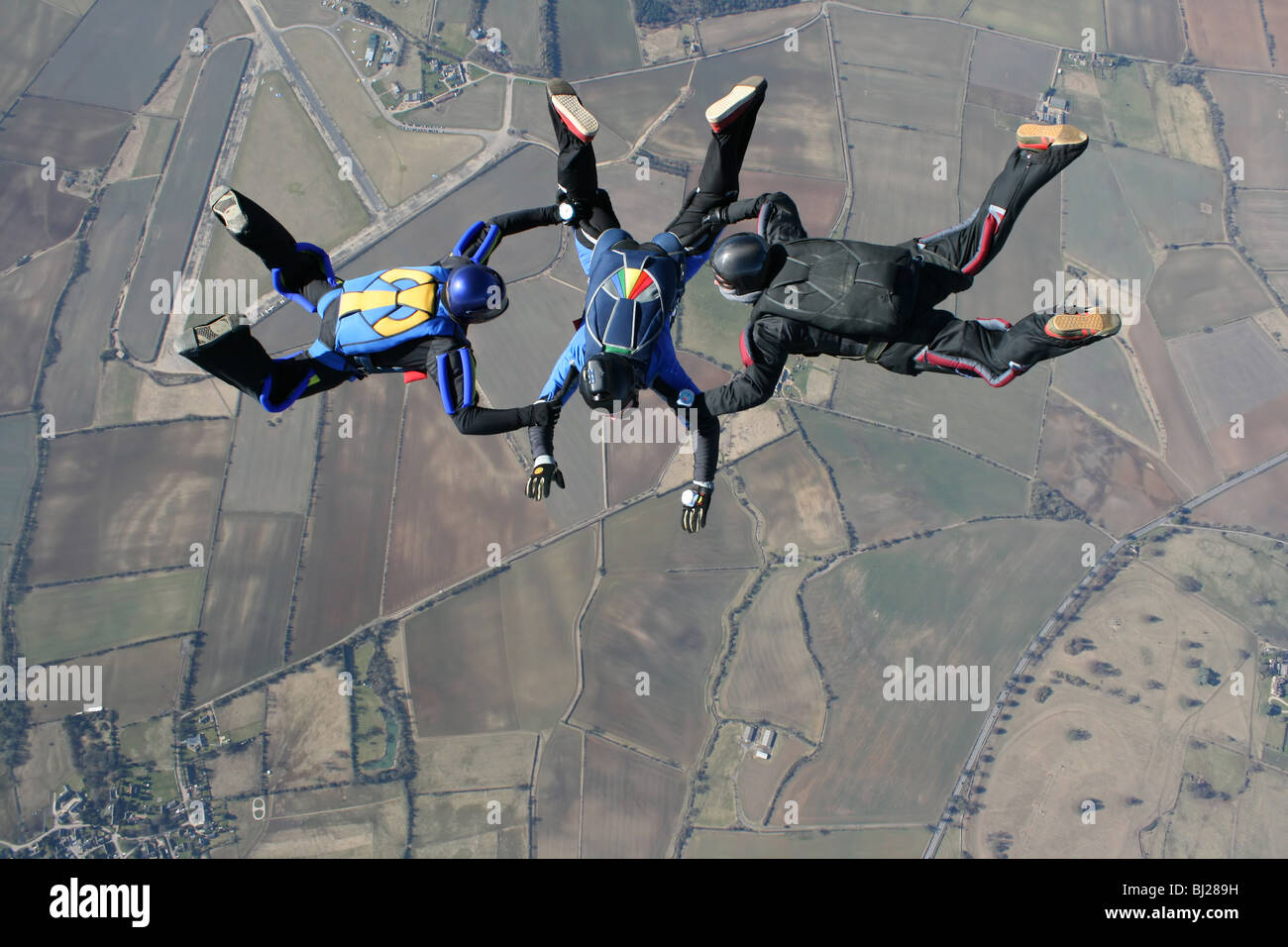 Three skydivers in freefall Stock Photo - Alamy