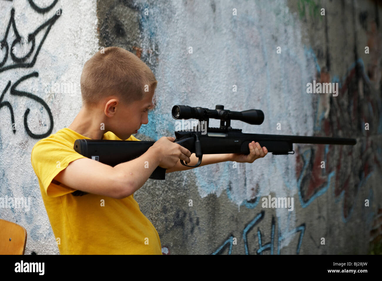 teenage boy aiming air rifle Stock Photo - Alamy