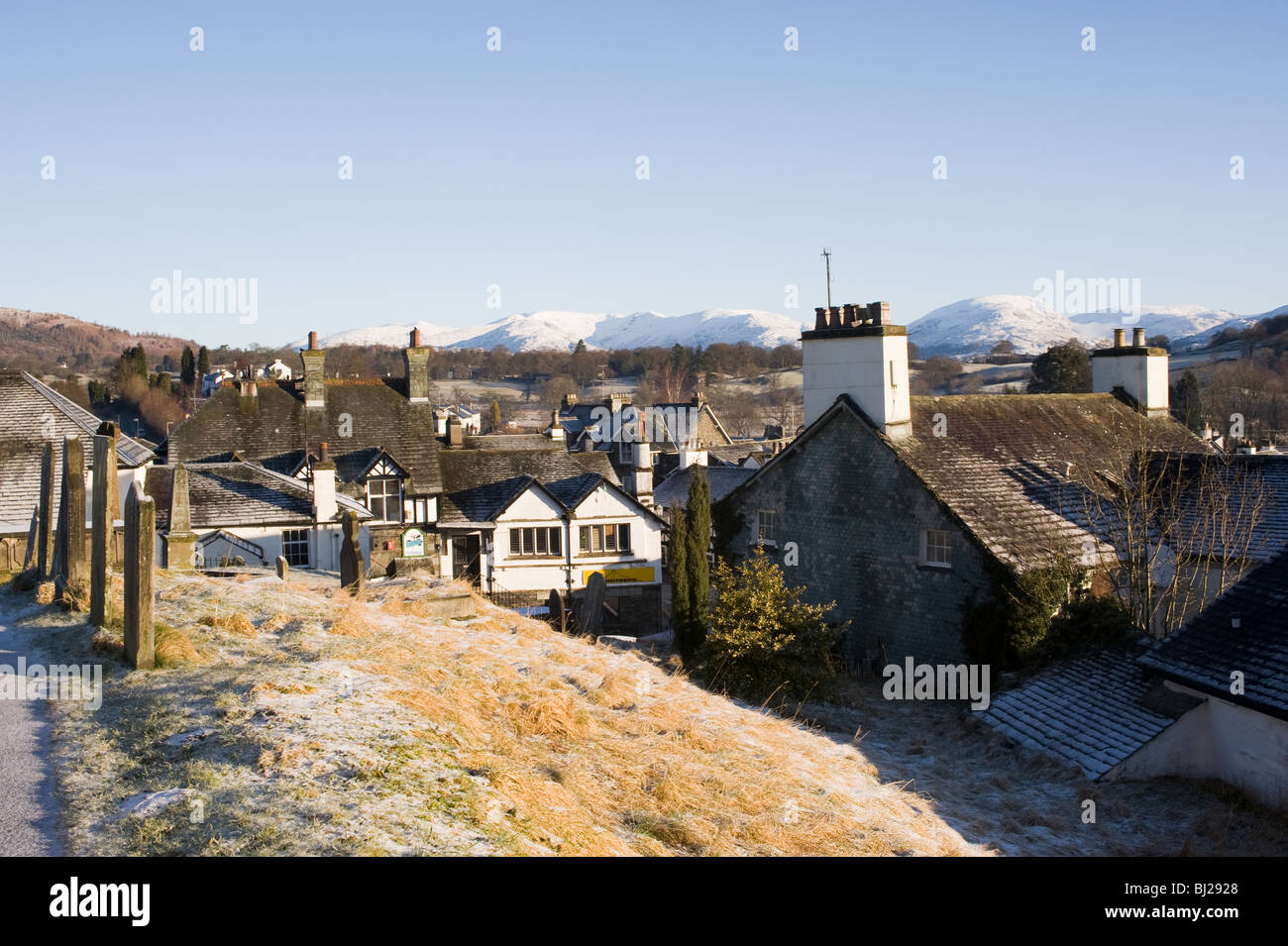 Hawkshead Village with Snow Covered Cumbrian Mountains in Early Morning ...