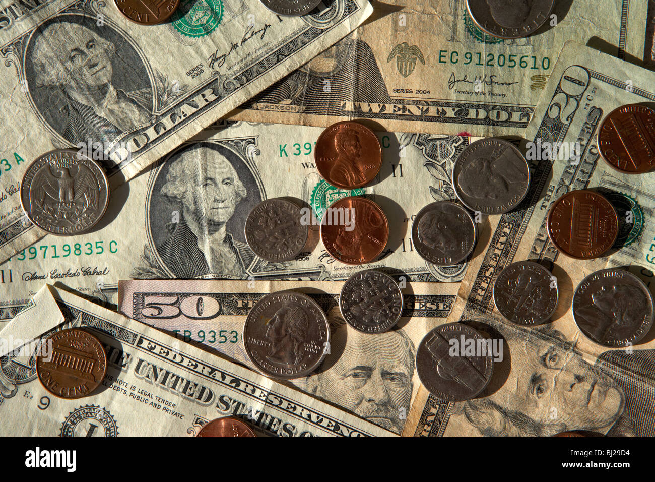 us dollar banknotes with coins Stock Photo - Alamy