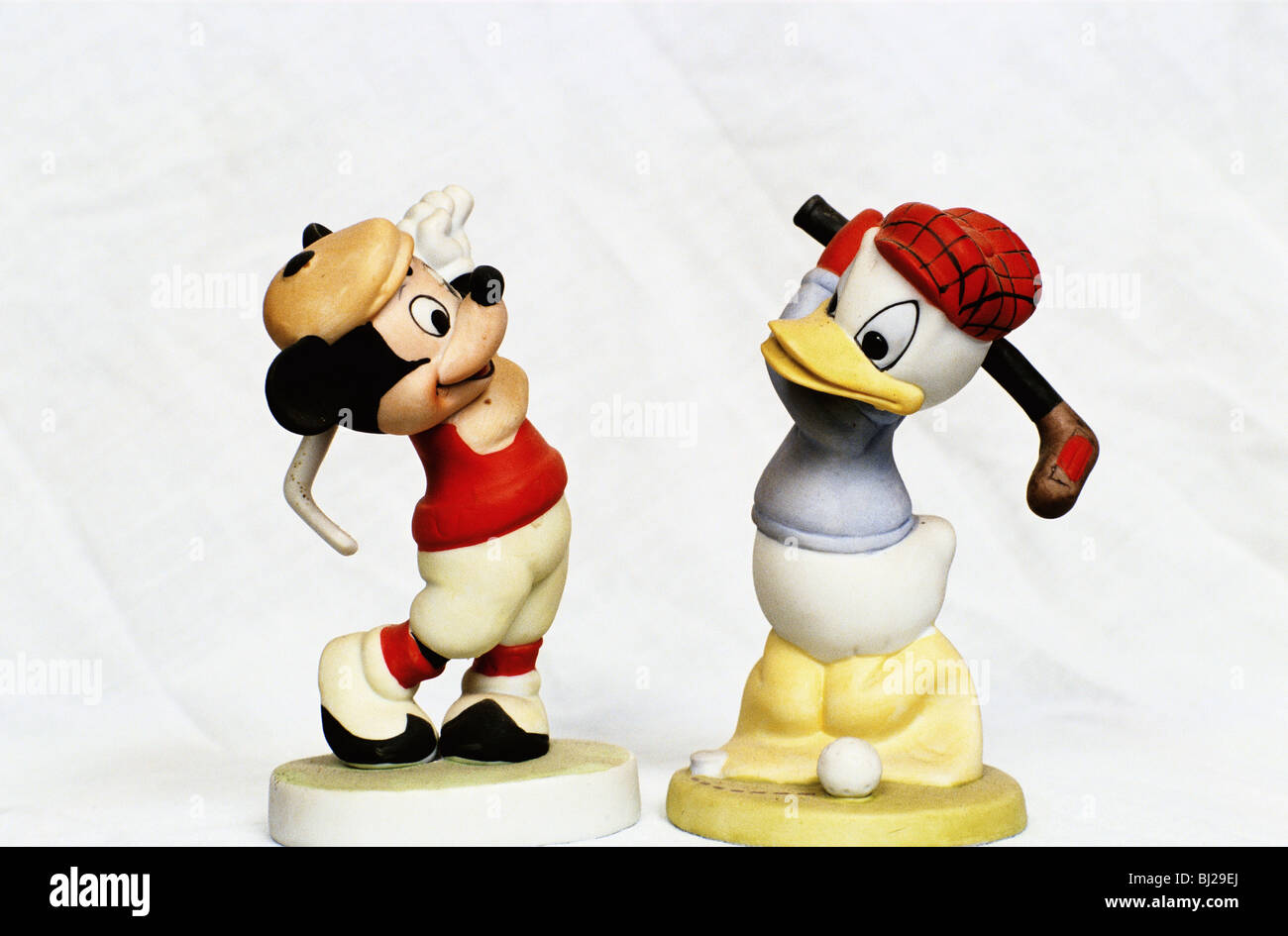 Hand-painted golfing figures of Mickey Mouse and Donald Duck, c1930s ...